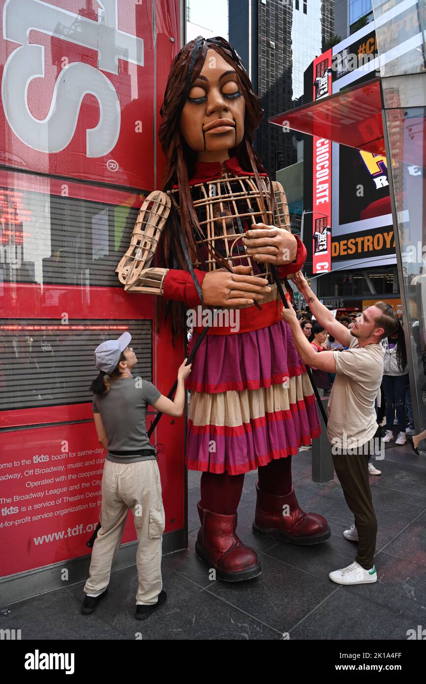 The 12-foot puppet known as "Little Amal" walks through Times Square as ...
