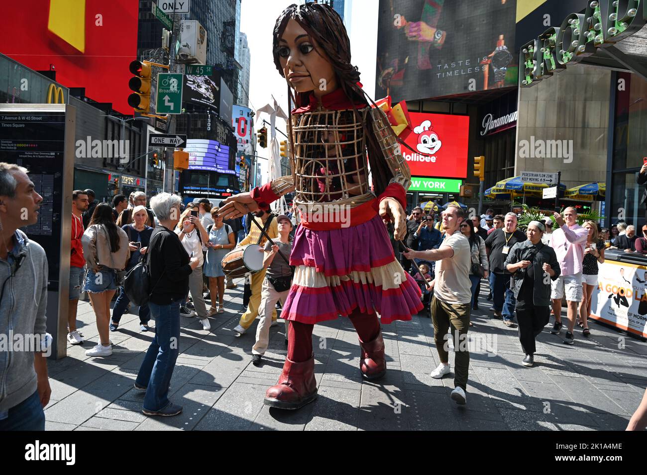 The 12-foot puppet known as "Little Amal" walks through Times Square as ...