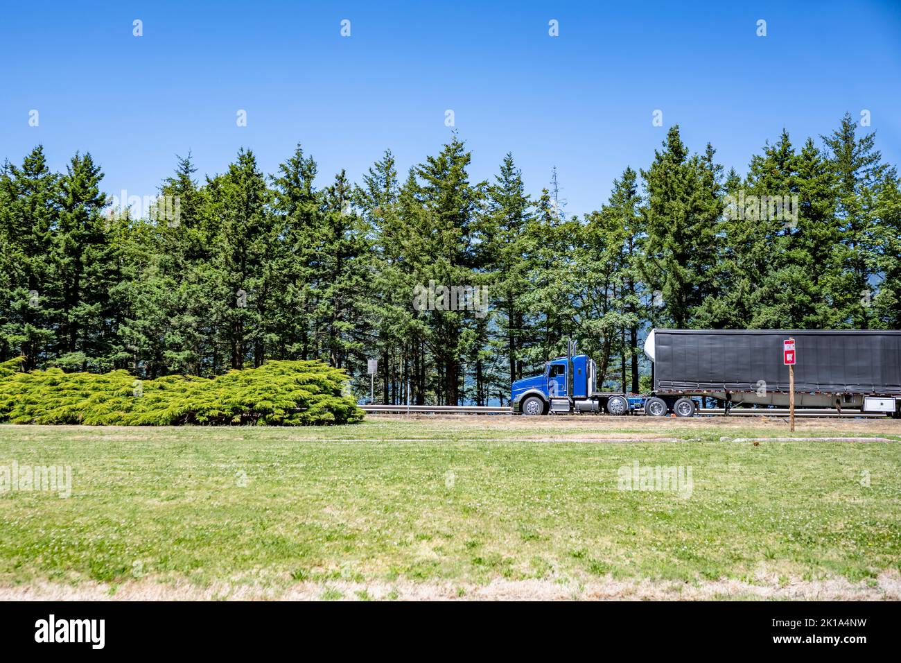 Profile of Industrial big rig blue American semi truck tractor ...