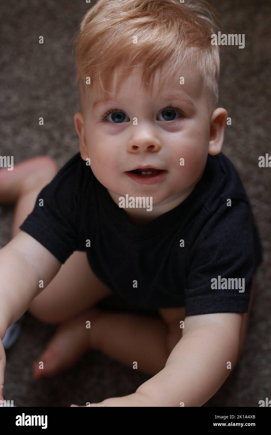 close portrait of a baby boy looking into camera Stock Photo - Alamy