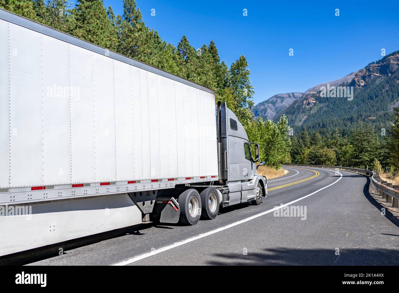 Light gray long haul big rig semi truck tractor with chrome exhaust ...