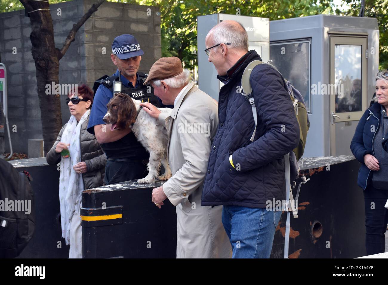 London, UK, 16 September 2022 The queue passes a security dog along the ...