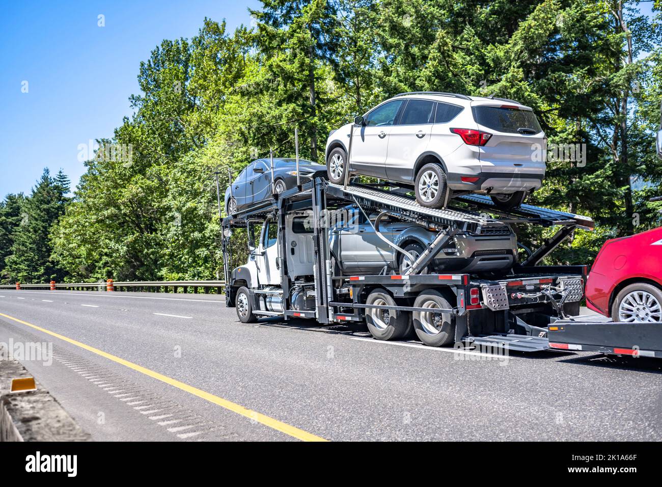 Industrial Big rig white classic car hauler semi truck tractor ...