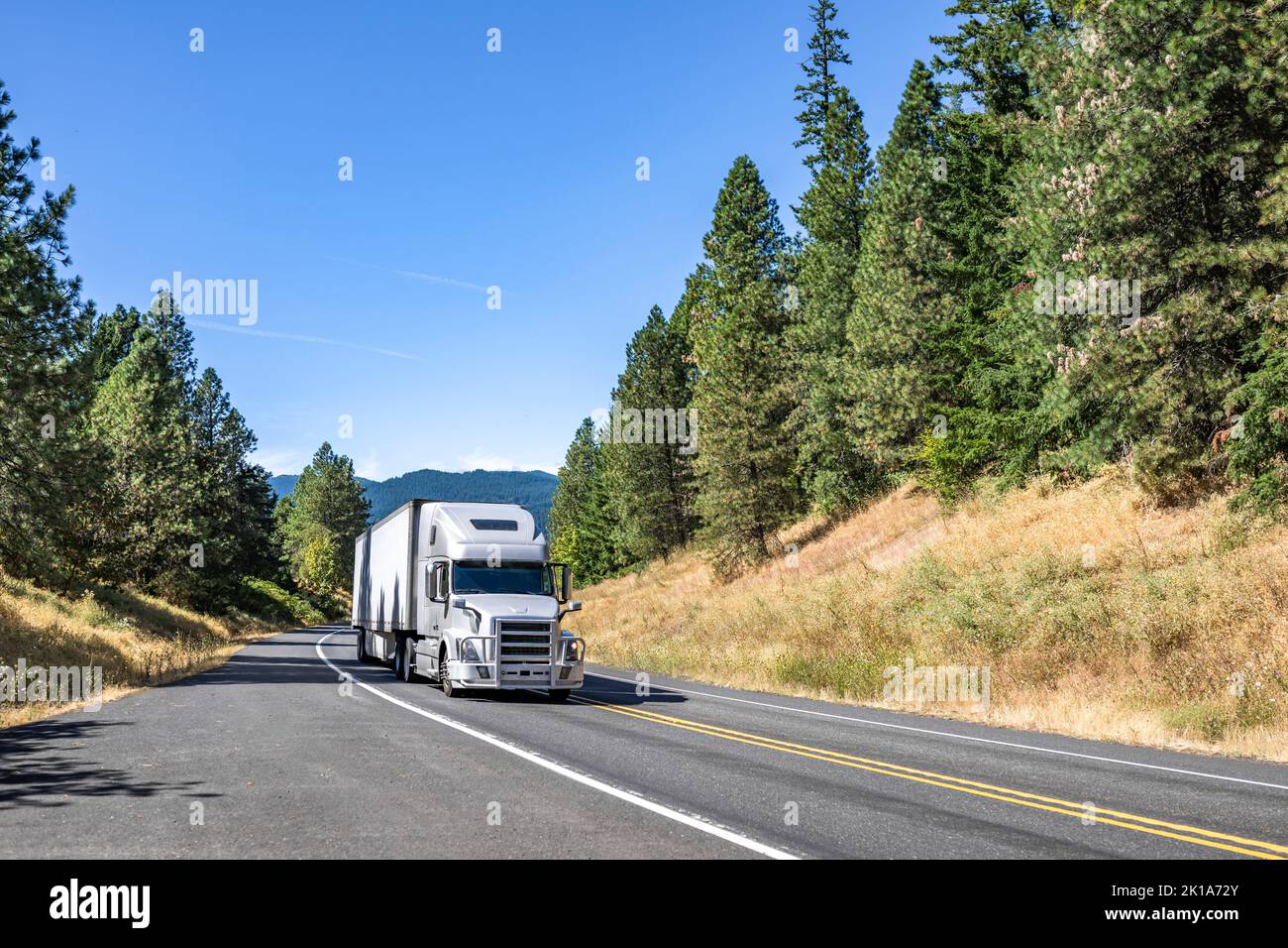 Light gray long haul big rig semi truck tractor with chrome exhaust ...