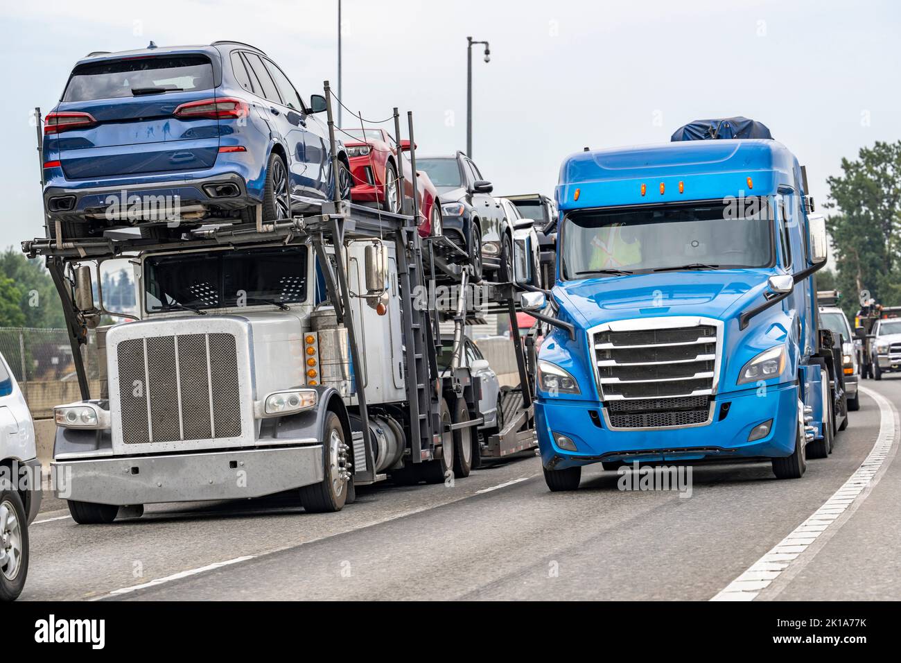 Industrial big rig car hauler semi truck tractor transporting cars on ...