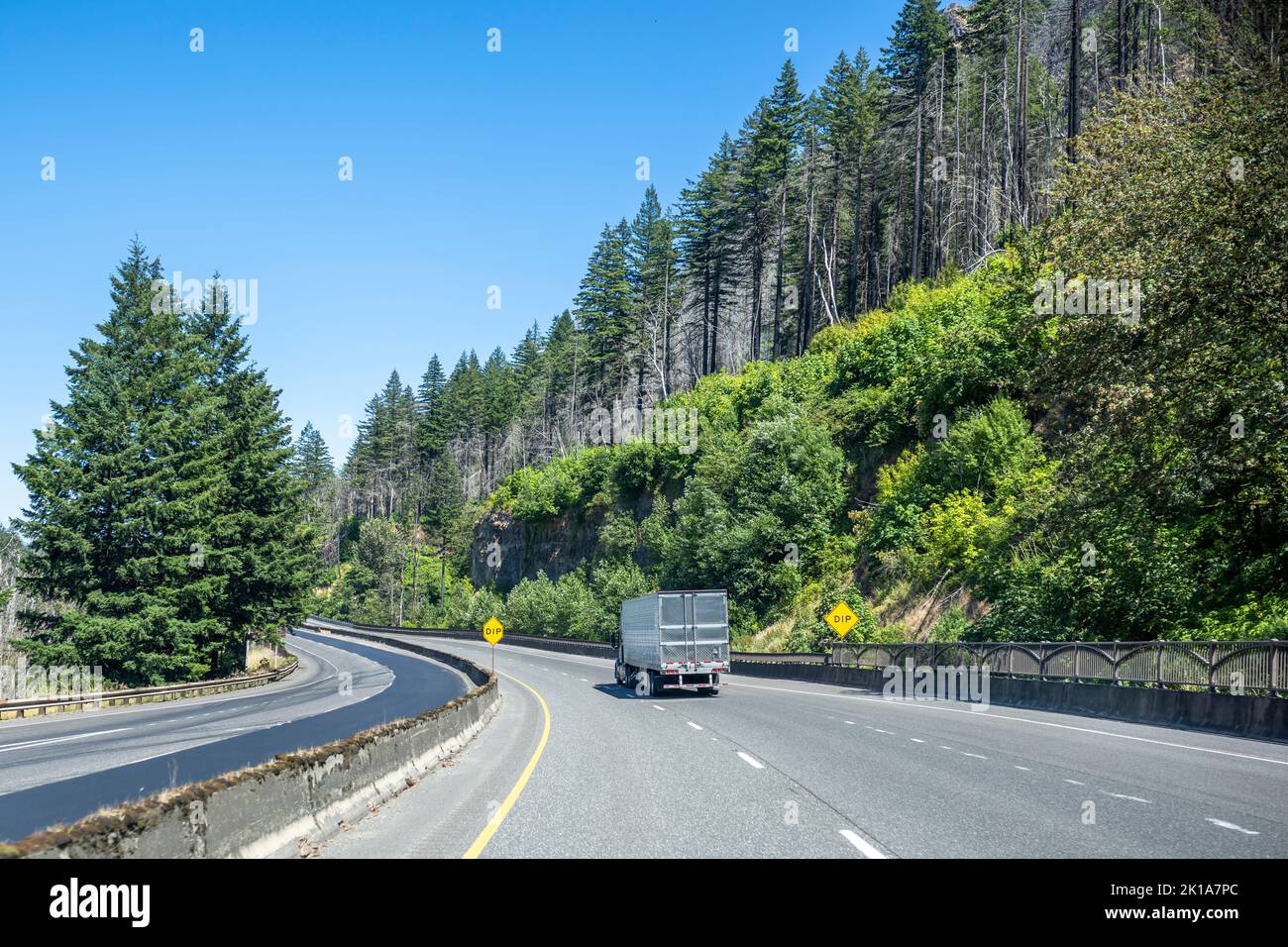 Classic blue long haul big rig semi truck tractor with chrome exhaust ...