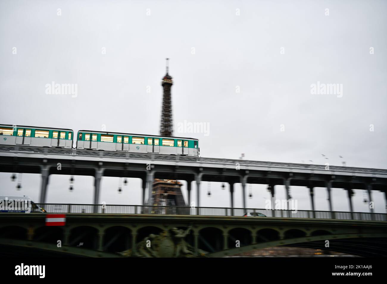 The parisian subway (metro, metropolitain) passes over a bridge with ...