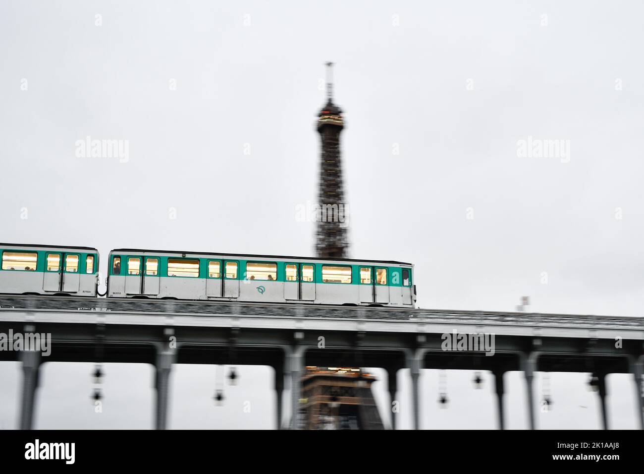The parisian subway (metro, metropolitain) passes over a bridge with ...