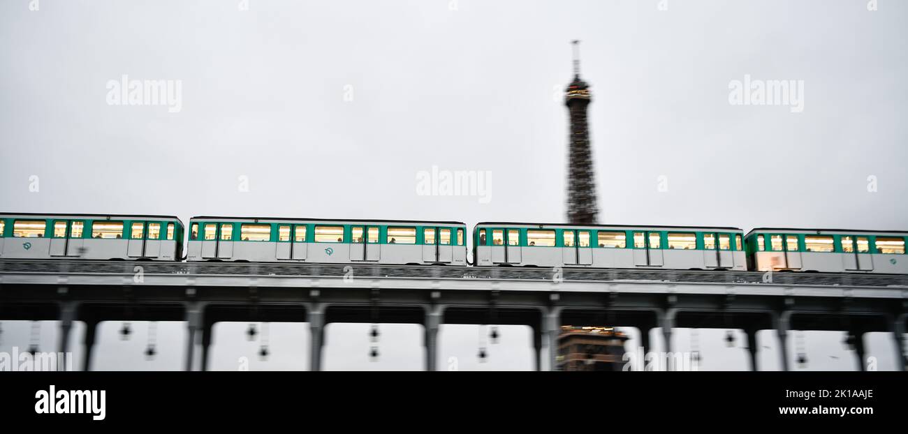 The parisian subway (metro, metropolitain) passes over a bridge with ...