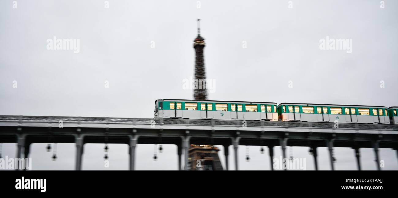 The parisian subway (metro, metropolitain) passes over a bridge with ...