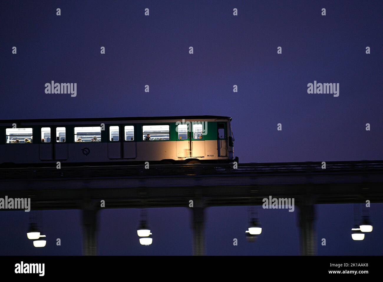 The parisian subway (metro, metropolitain) passes over a bridge at ...