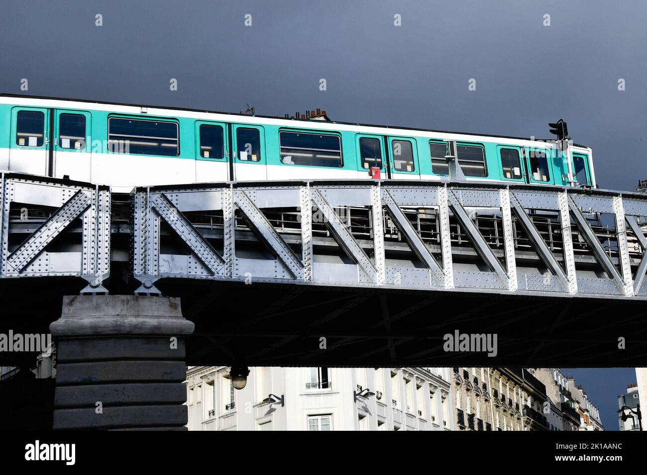 The parisian subway (metro, metropolitain) passes over a bridge in ...