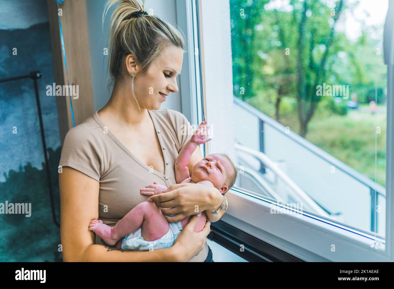Experiencing life and developing new skills. Little caucasian baby boy ...