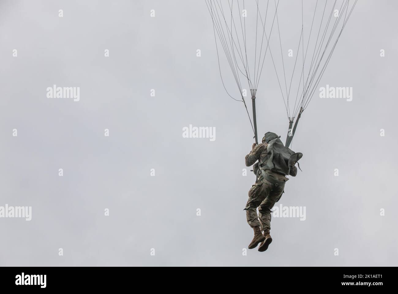 A U.S. Army Paratrooper conduct an Airborne jump out of a C-130 ...