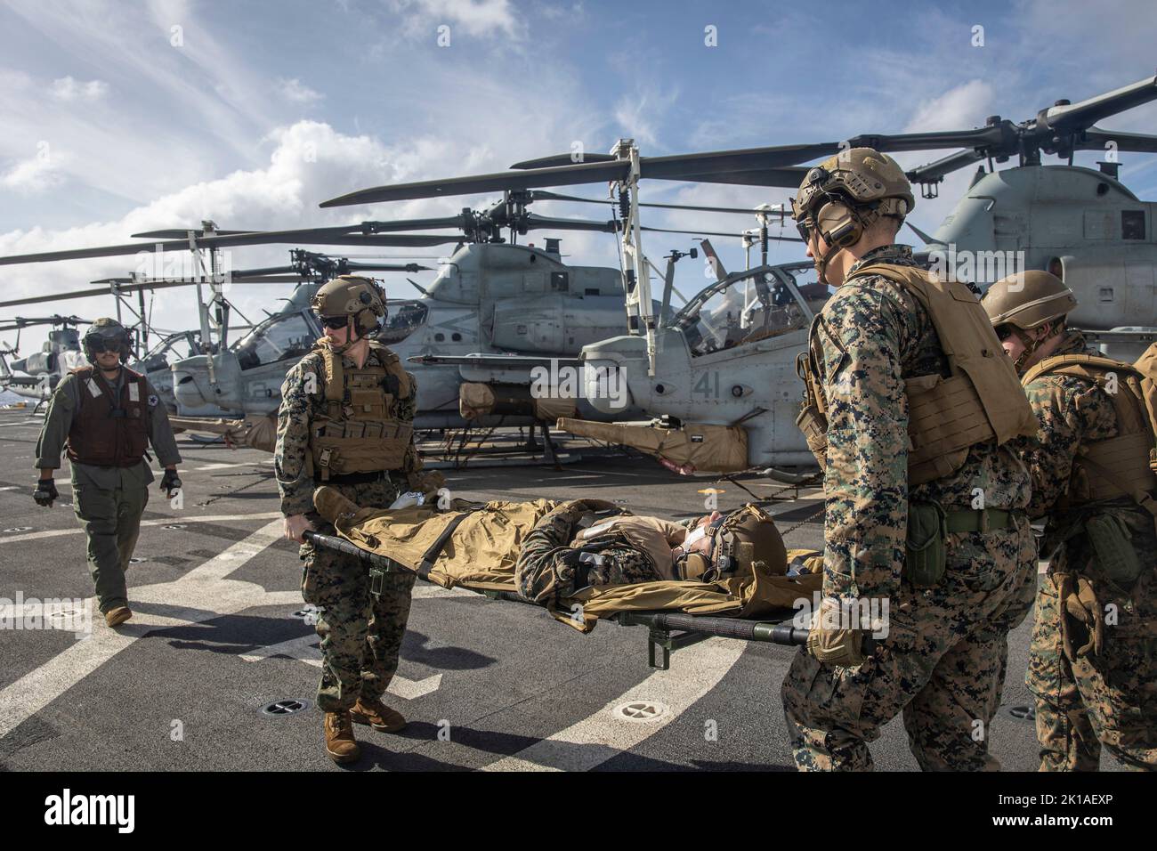 U.S. Marines with Battalion Landing Team 2/5, 31st Marine Expeditionary Unit, carry a simulated ...