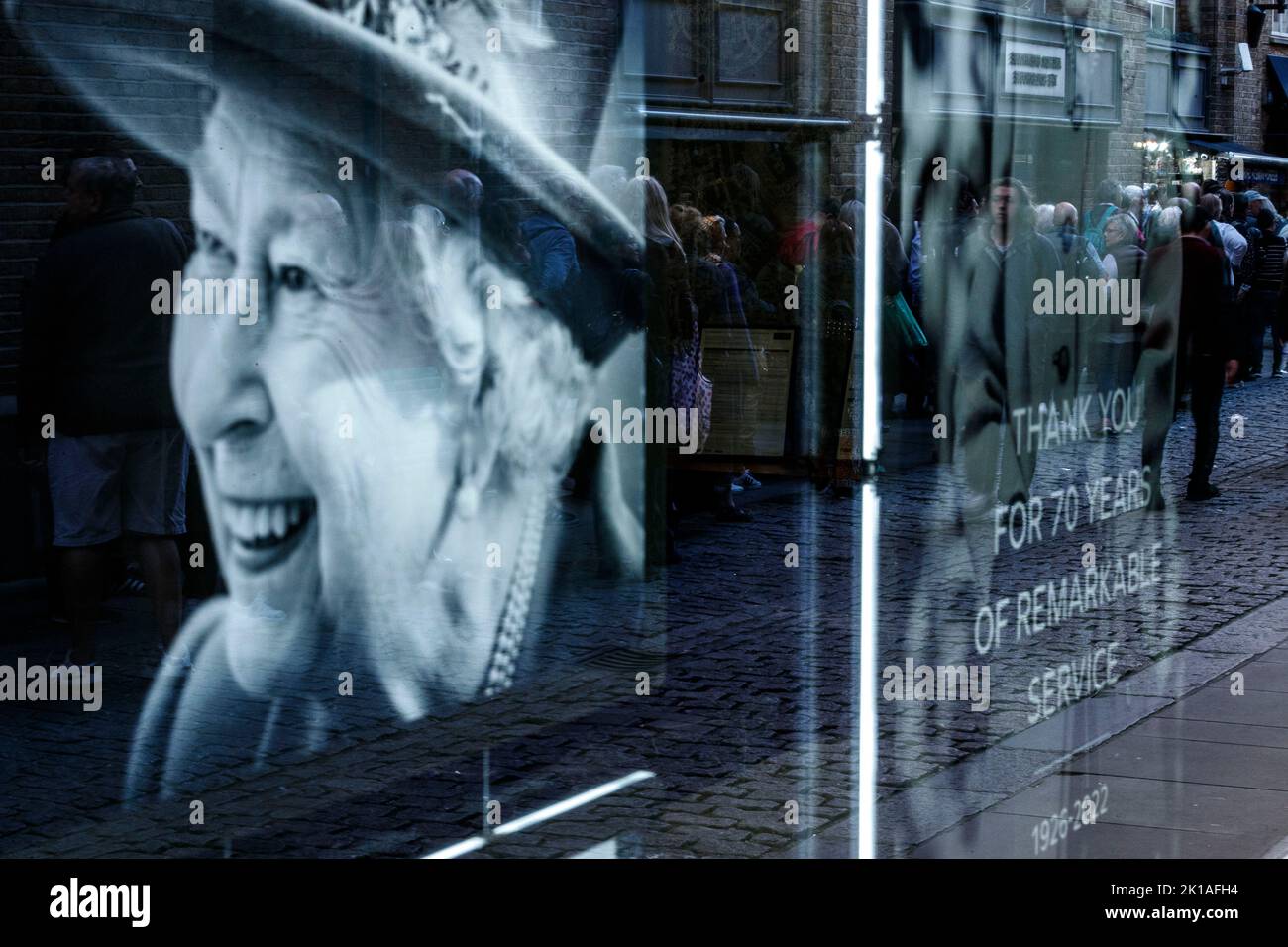 London, UK. 16th Sep, 2022. Queue is reflected on a shop window which ...