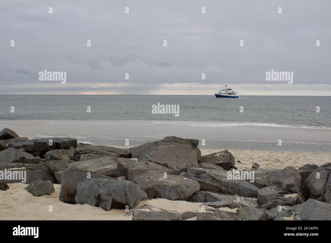 Boat off shore Stock Photo - Alamy