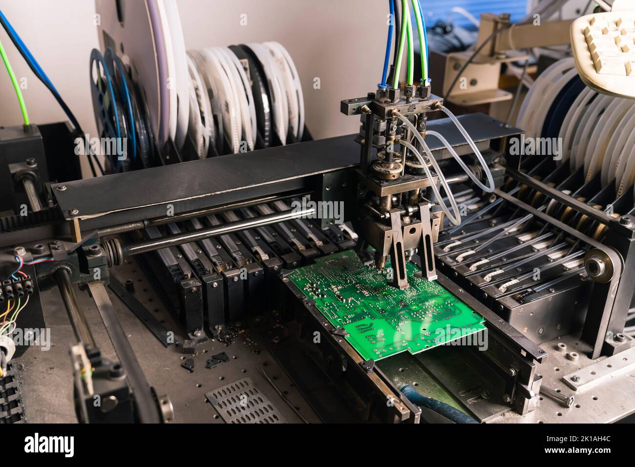 Working surface-mount device assembling electrical components on ...