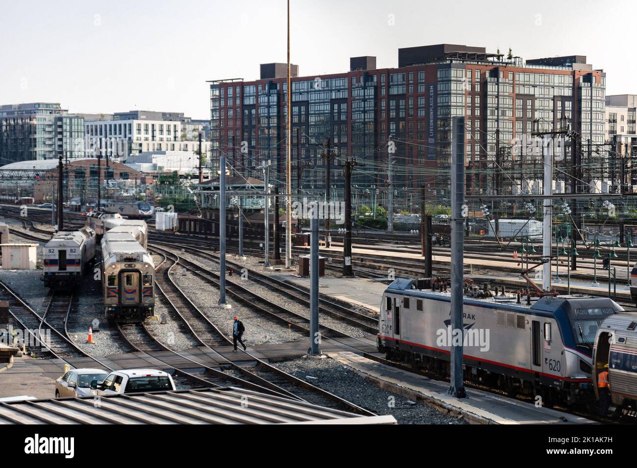 Amtrak trains stand along the tracks. President Joe Biden announced a ...