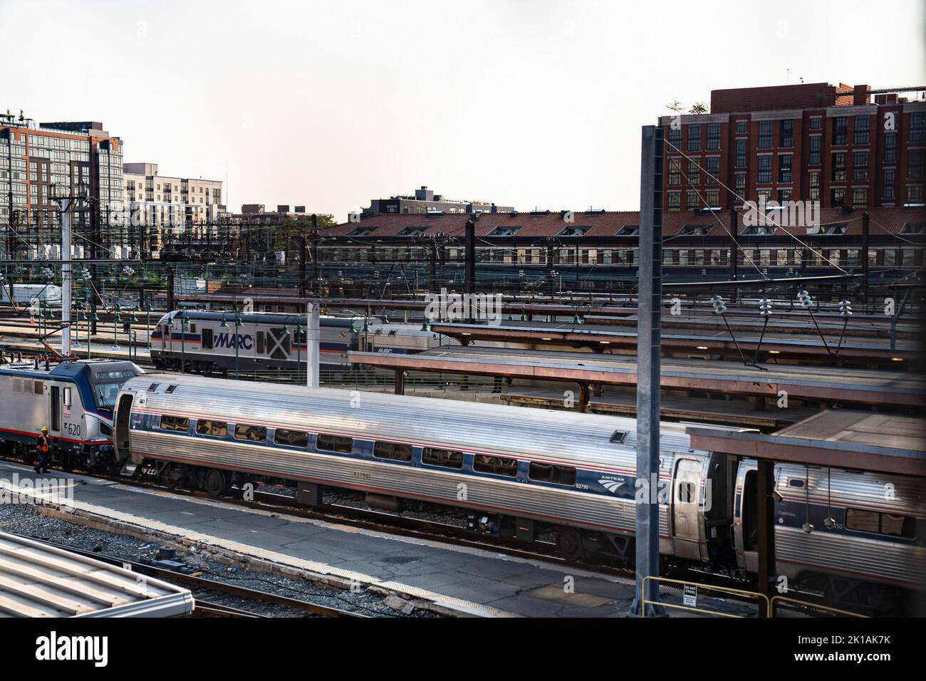 Amtrak trains stand along the tracks. President Joe Biden announced a ...