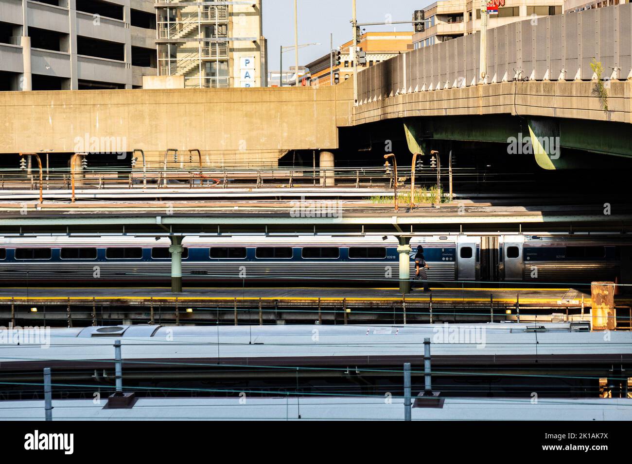 Amtrak trains stand along the tracks. President Joe Biden announced a ...