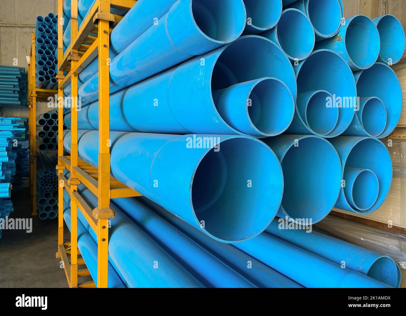 PVC pipes stacking on shelf in warehouse Stock Photo - Alamy