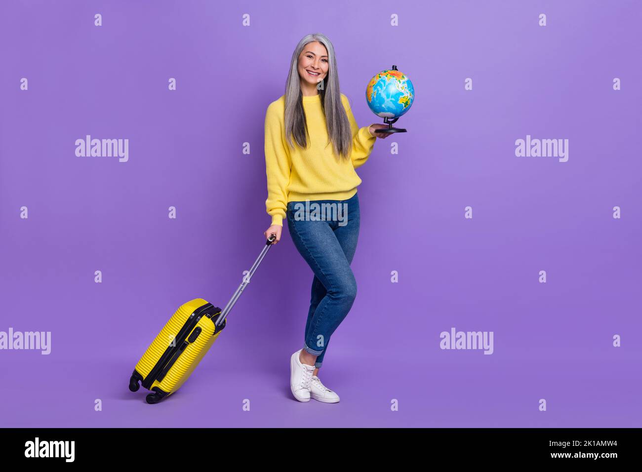 Photo of funky charming lady pensioner dressed pullover carrying ...
