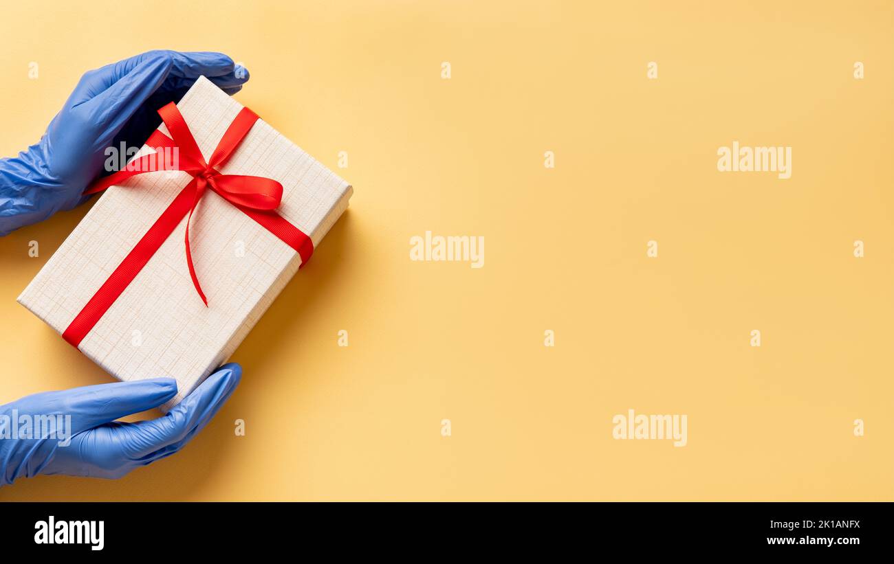 Greeting invitation. COVID-19 prevention. Hands in medicine gloves ...