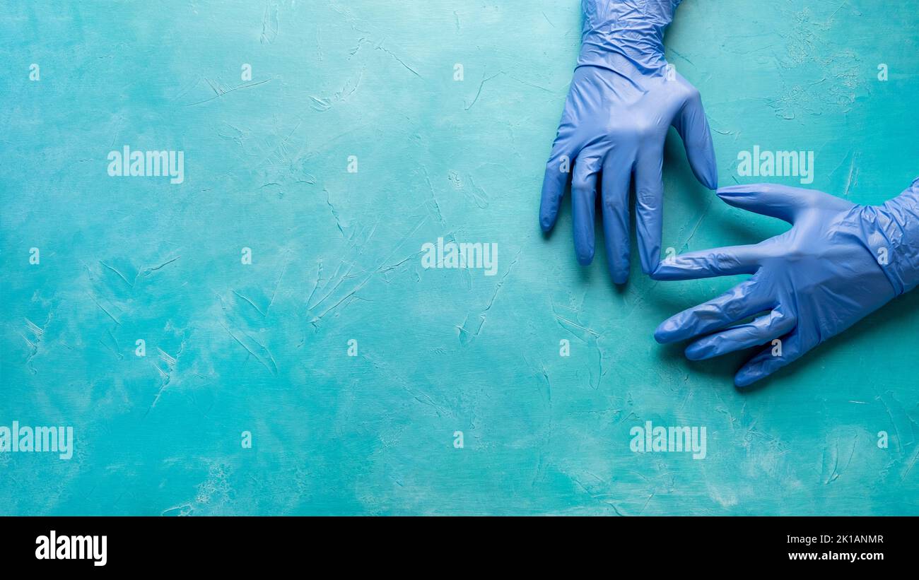 COVID-19 prevention. Stay safe. Doctor hands in medicine gloves showing ...