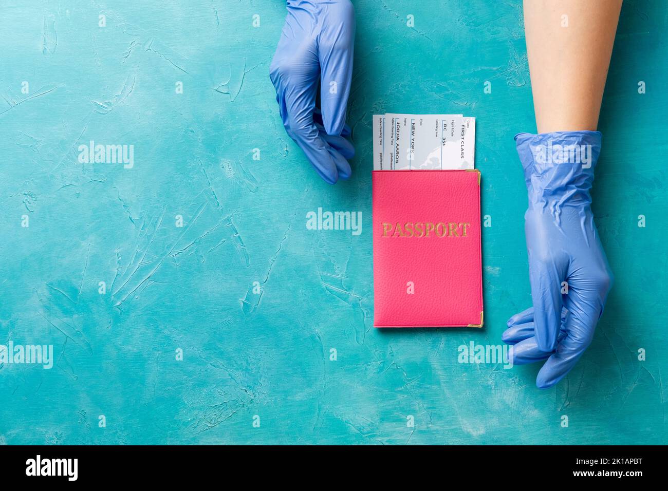 Passport control. Traveling restriction. Hands in medicine gloves ...