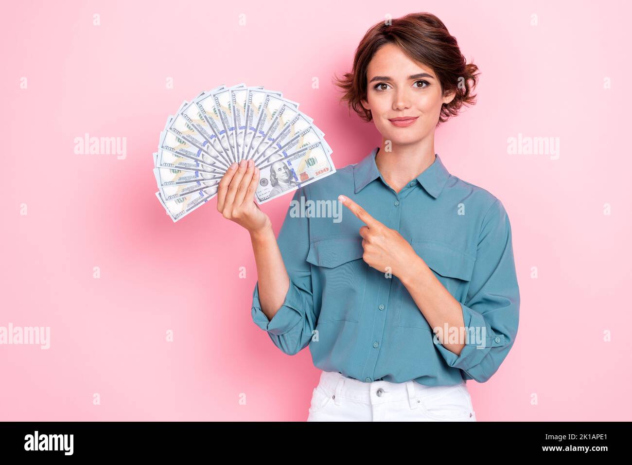 Photo portrait of nice young woman hold point money dollar banknotes ...