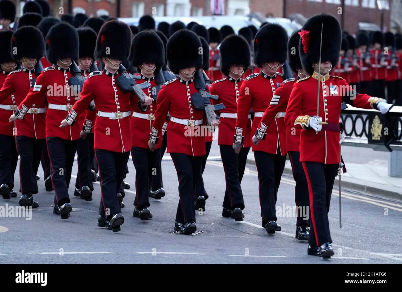 Members of the Coldstream Guards march down towards Victoria barracks ...