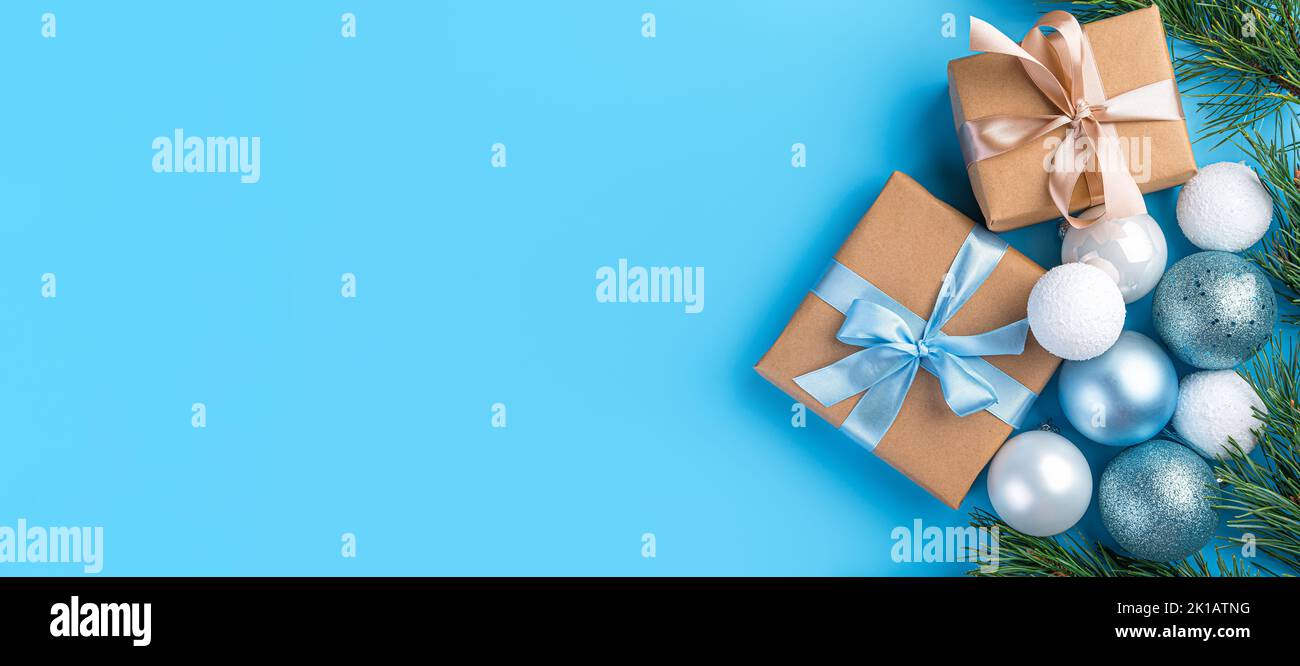 Christmas background with gifts, ribbons, toys and pine branches on a ...