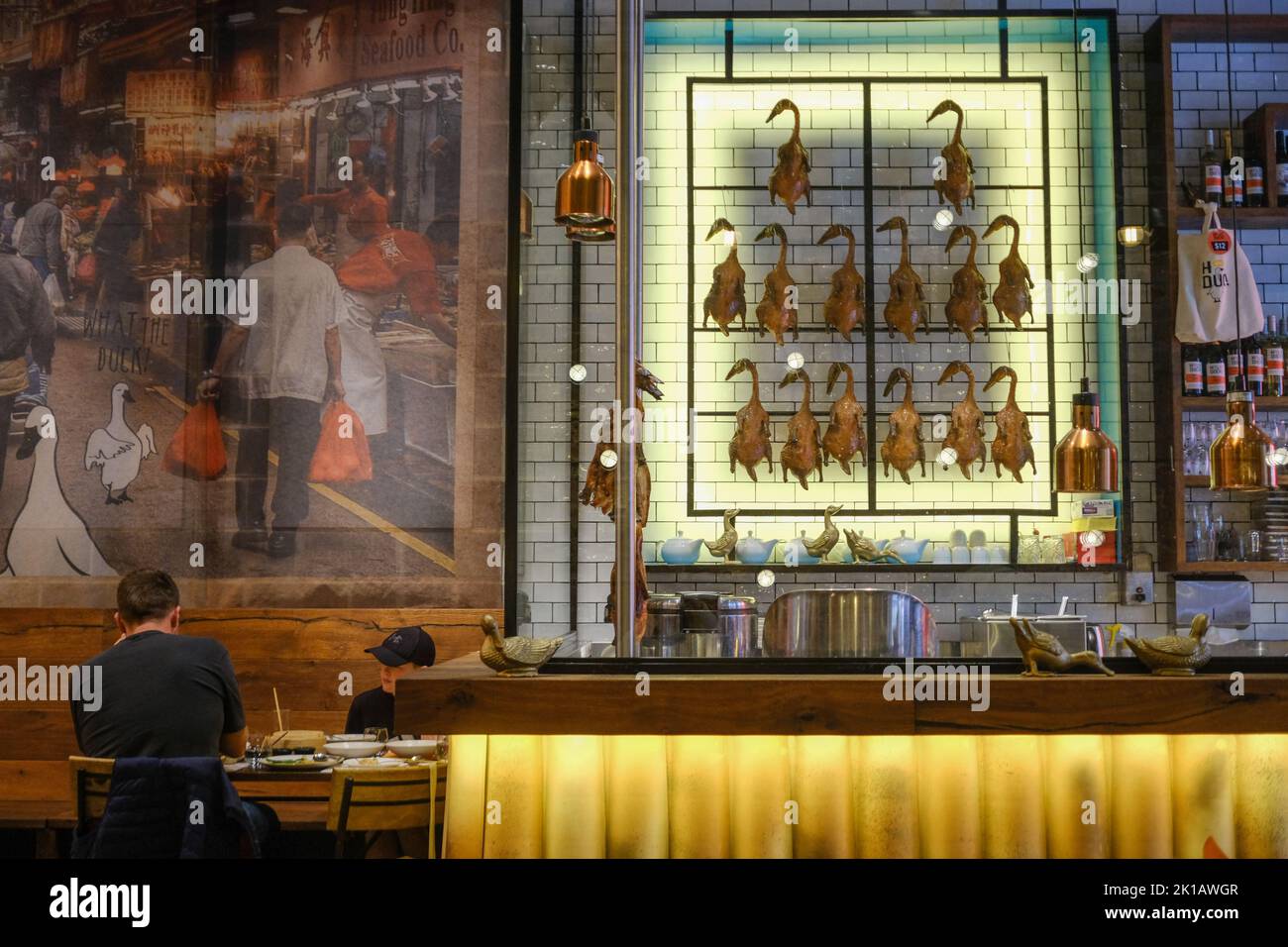 Customers dining at Holy Duck, a modern Asian restaurant near Spice ...