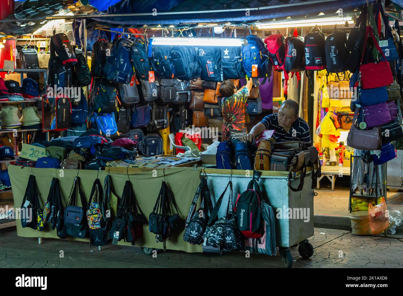A Street Trader at Petaling Street night market, Chinatown, Kuala ...