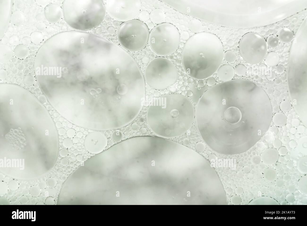 Drops of fat in water. Bubbles of fat close up Stock Photo - Alamy