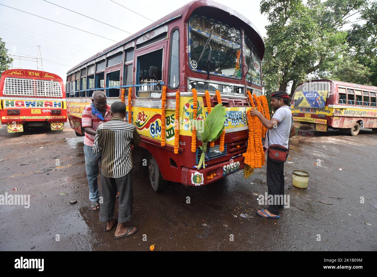 Howrah, India. 17th Sep, 2022. Staff members of a mini bus are ...