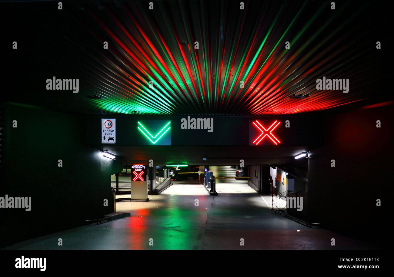 Futuristic modern garage entrance glowing in green and red Stock Photo ...