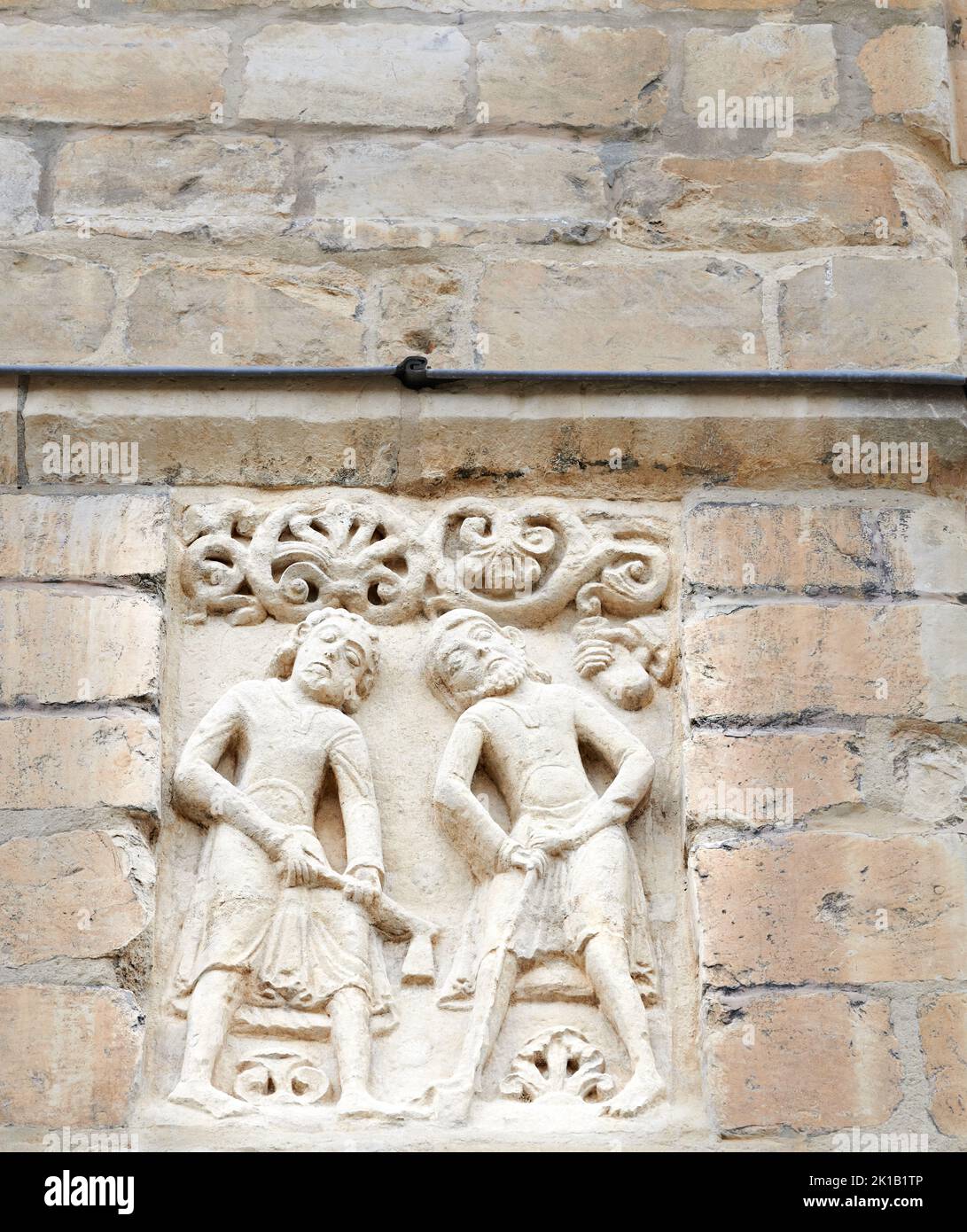 Twelfth century carved stone frieze (of Cain and his father Adam ...
