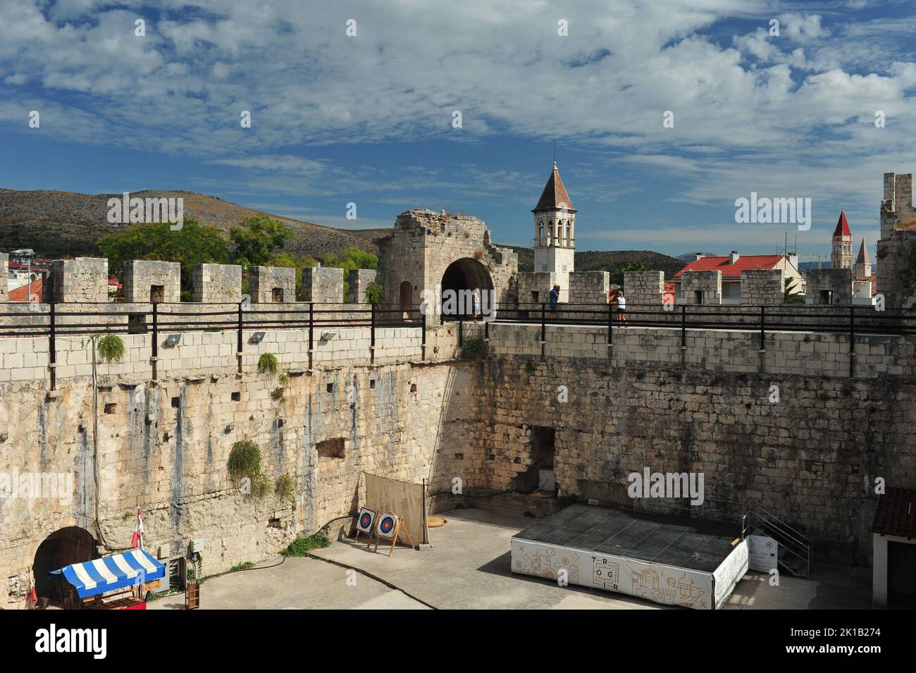 Inside the Kamerlengo castle yard in Trogir, Croatia. Touists walking ...
