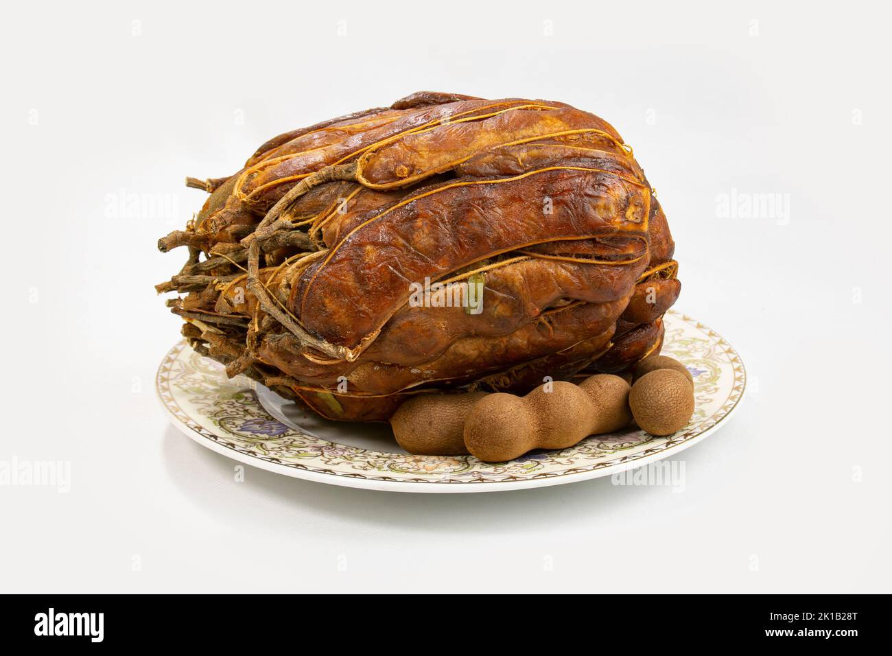 Ripe peeled Tamarind stack on white background. Scientific name ...