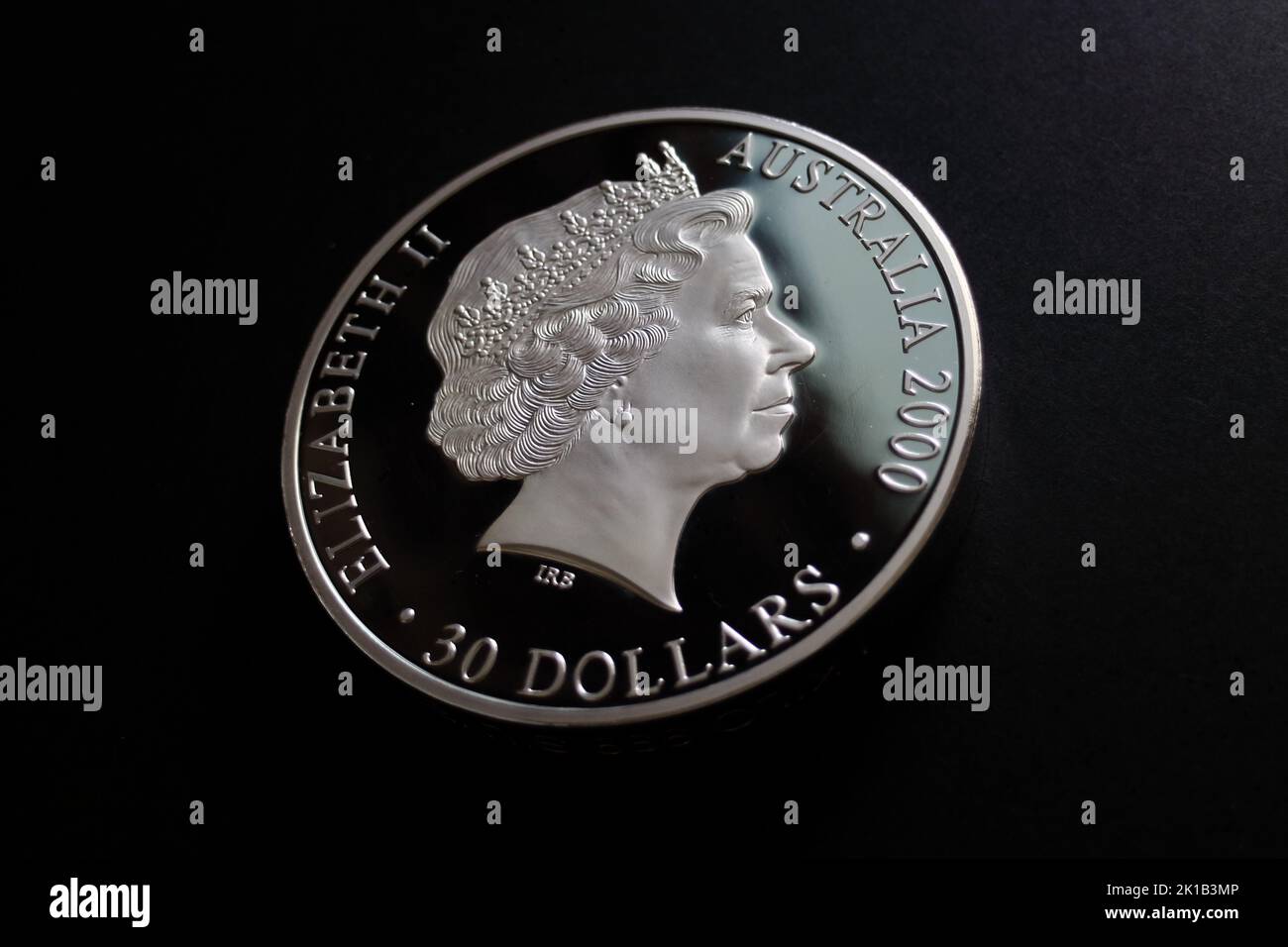 Queen Elizabeth II 30 dollars 1 kg silver coin on black background ...