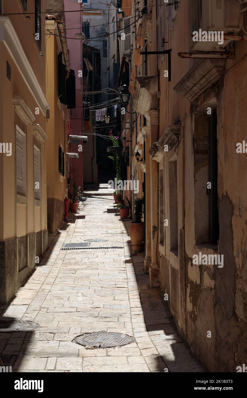 A view of a typical narrow street in the old town of Corfu. Nice ...