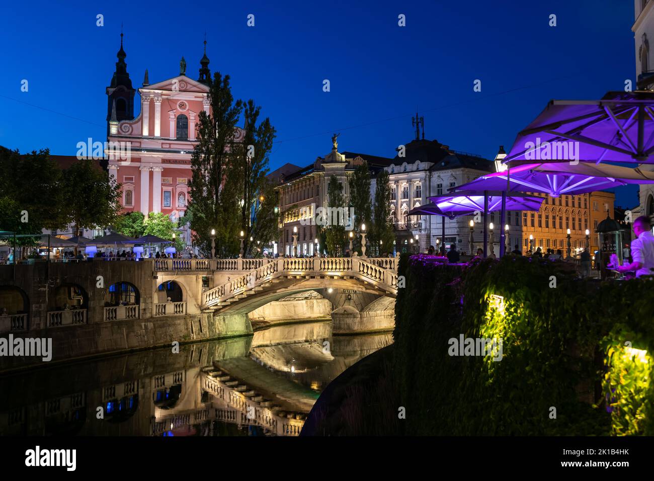City of Ljubljana by night in Slovenia, illuminated Triple Bridge over ...
