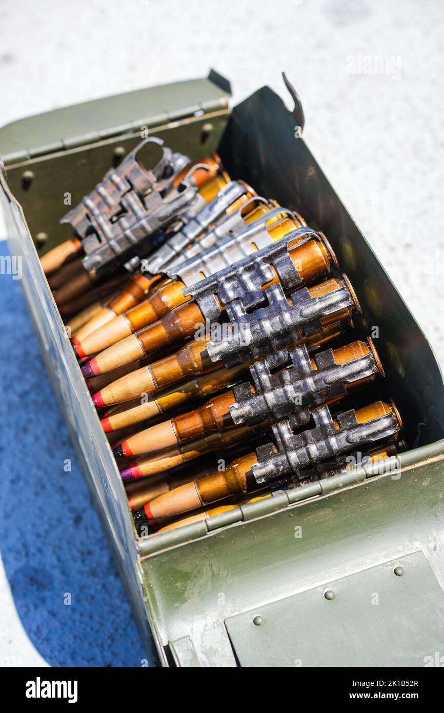Close up shot of a machine gun belt loaded with cartridges, in an ammo ...