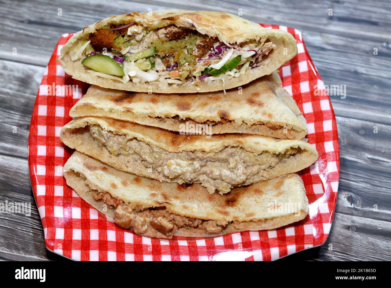 Traditional Egyptian popular breakfast street sandwiches of mashed fava ...