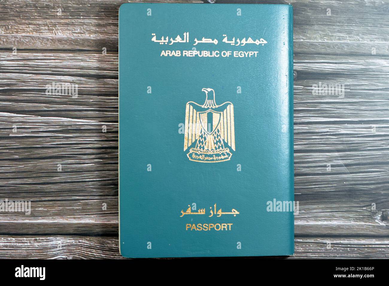 Egyptian passport isolated on wooden background, Arab republic of Egypt ...