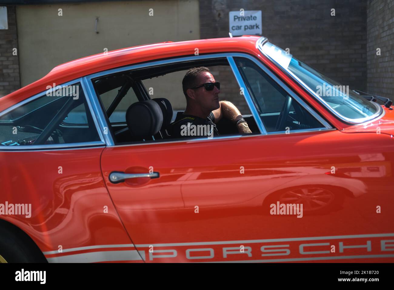 cool guy in a vintage Porsche Stock Photo - Alamy