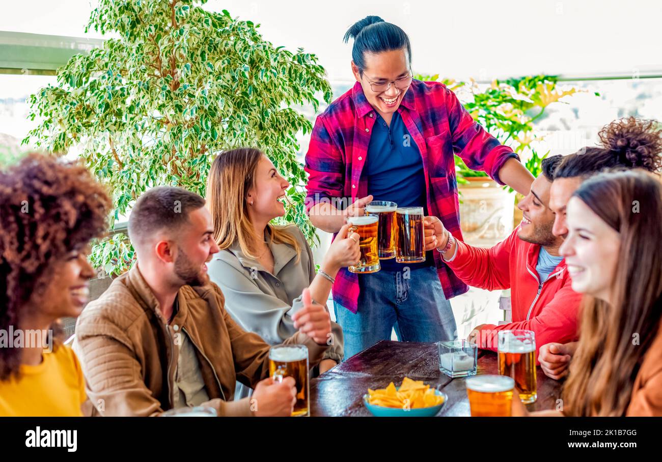 International Group Of Friends Making A Celebratory Toast Drinking Beer