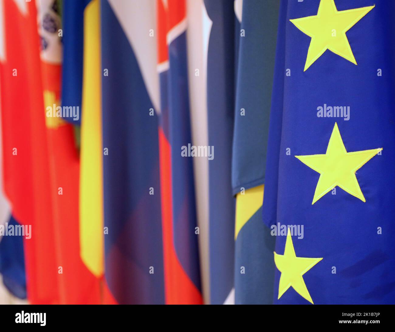 Three yellow stars on a blue background of the flag of the European ...